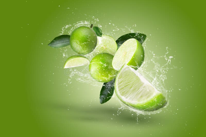 Lemonade Splashing on Green Lemon Fruit Isolated on Green Background ...