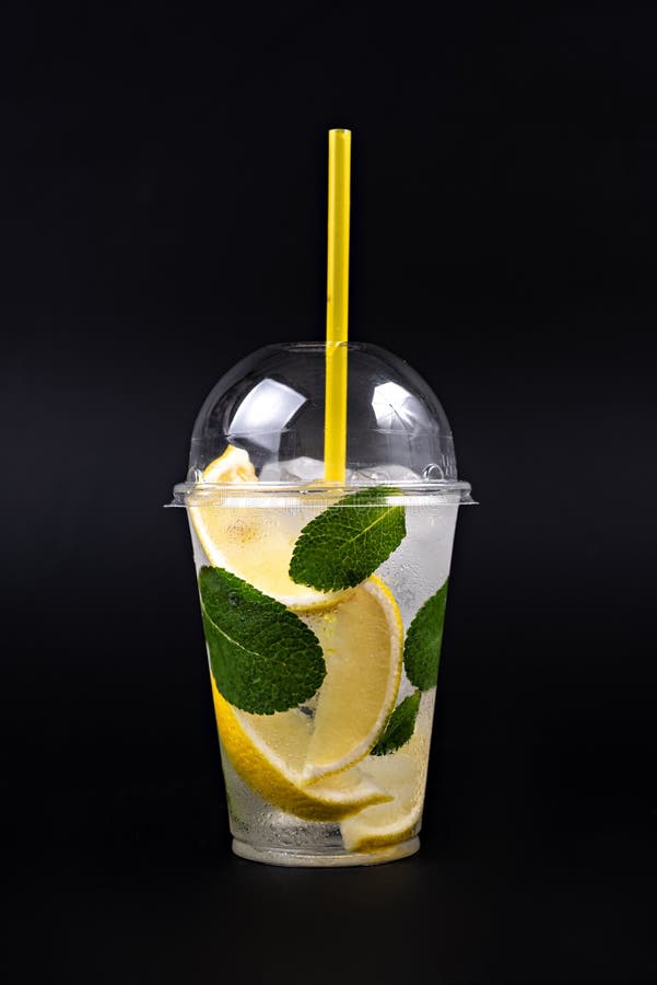 Lemonade To Go Cup with Mint Leaves on Green Background Stock Image ...