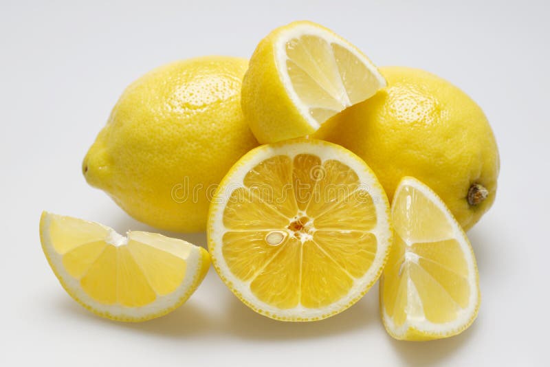 Pile of Lemons Whole and Cut Stock Photo - Image of wedge, arrangement ...