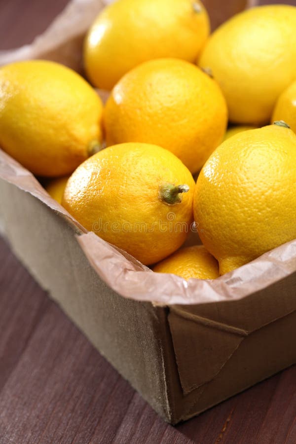 Lemons in box - close-up stock image. Image of close - 52111701