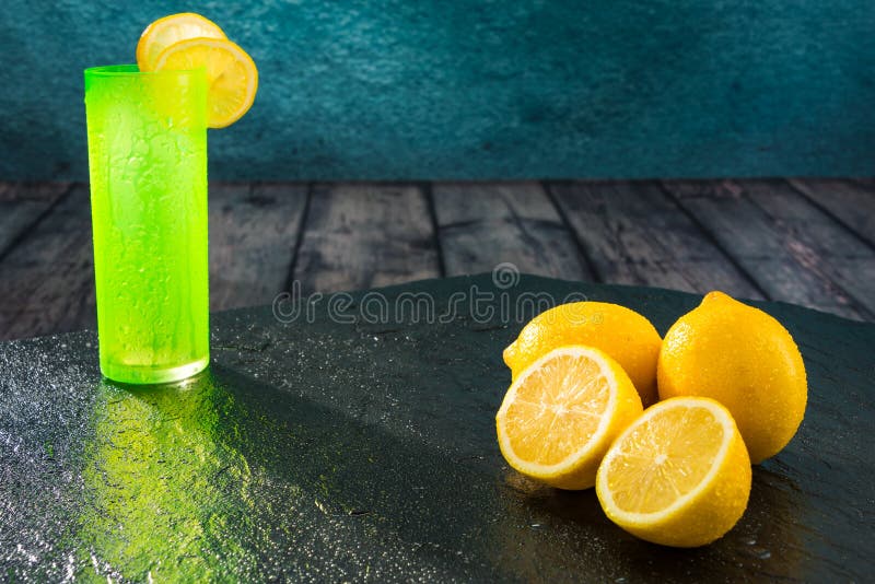Lemons and colored glasses stock image. Image of glass - 74442865