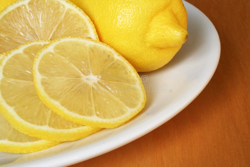 Lemons on the plate stock photo. Image of detail, isolation - 1483946