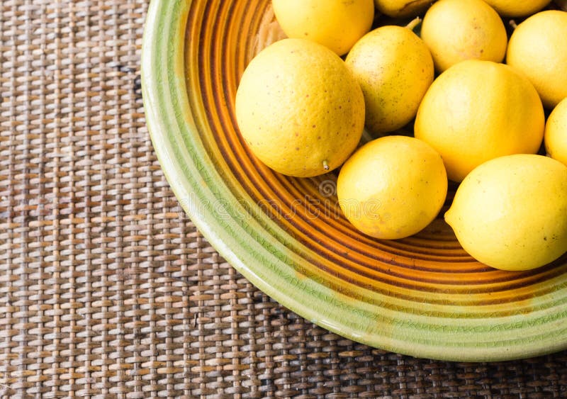Lemons on plate (cropped) stock image. Image of ripe - 72679667