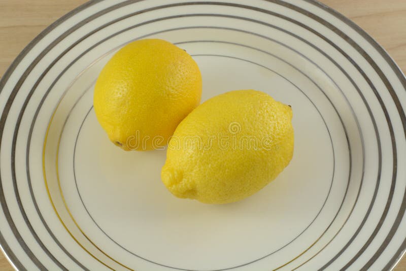 Lemons on plate stock photo. Image of white, citrus, plate - 81939020