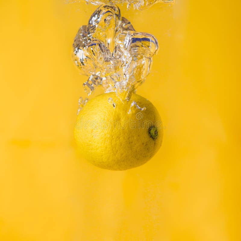 Lemons Thrown into the Water Stock Image - Image of object, drop: 68779225