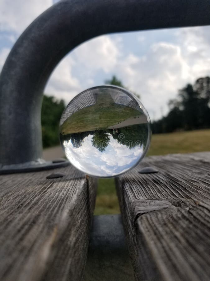 Lens Ball on Bench stock image. Image of darkness, wheel - 252849147