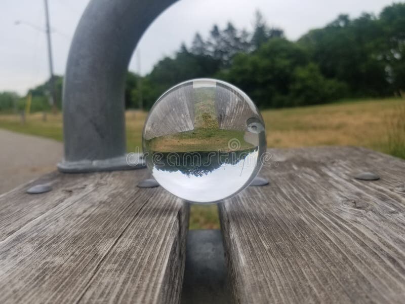 Lens Ball on Park Bench stock image. Image of tree, lighting - 250781477
