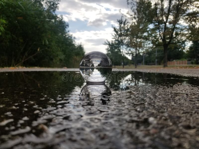 Lens Ball and Water stock photo. Image of lens, waterway - 257068346