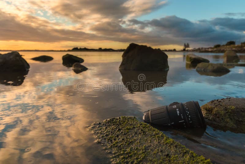 Lens in Water stock photo. Image of float, lens, rocks - 47556190