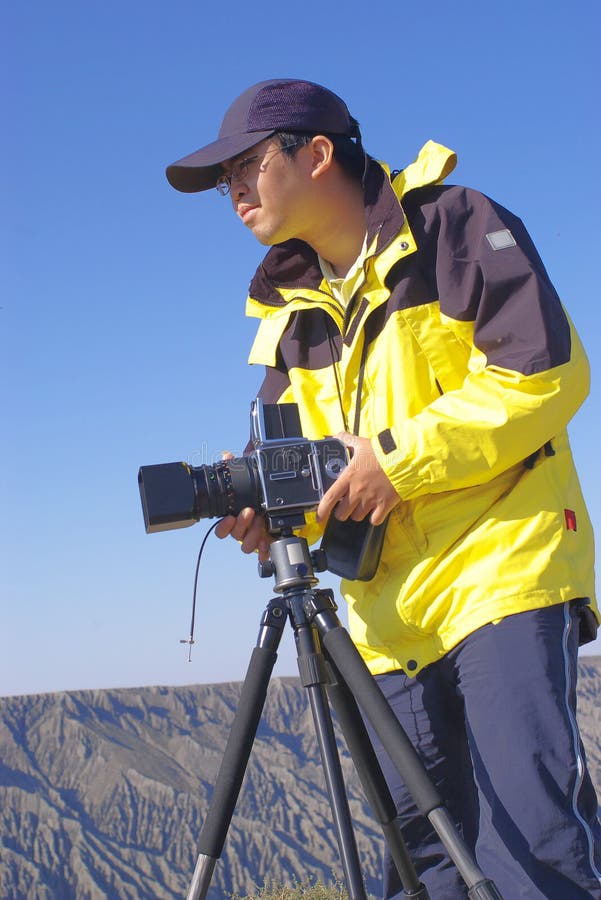 Lensman and his camera stock image. Image of lensman, graveness - 7304681