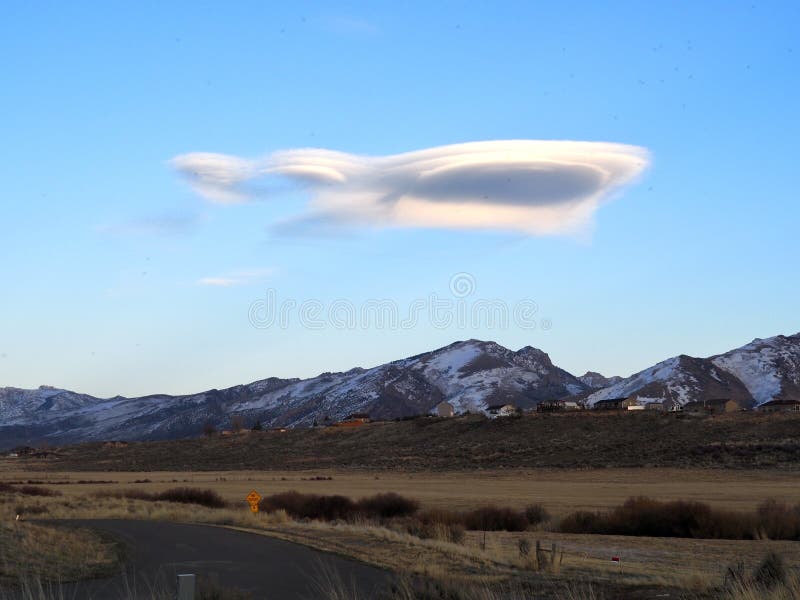 Lenticular Cloud or Mountain Wave Cloud Over Mountains Stock Image ...