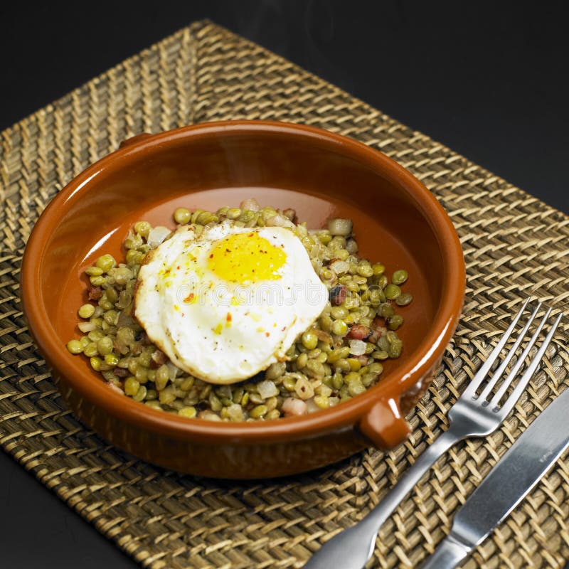 Lentils with fried egg stock photo. Image of inside, dish - 17236576