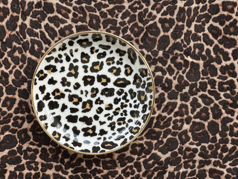 Leopard Print Plate on Leopard Print Textile Stock Image - Image of ...
