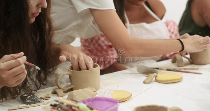 Lesson in a Workshop, Teacher Explains To Students How To Make Mug from ...