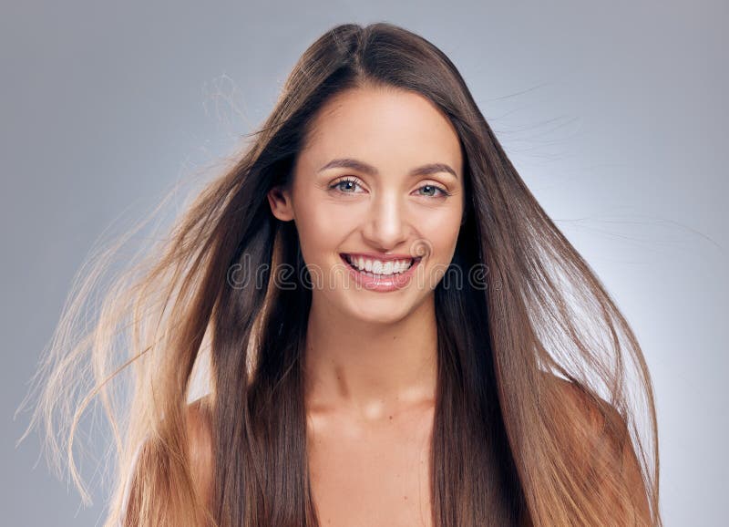 Let Go and Feel the Breeze. an Attractive Young Woman Standing Alone in ...