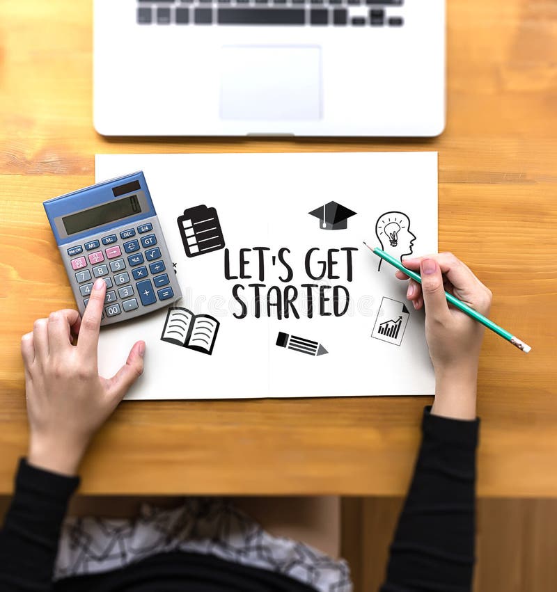 LET S GET STARTED Two Businessman Working at Office Desk and Usi Stock ...