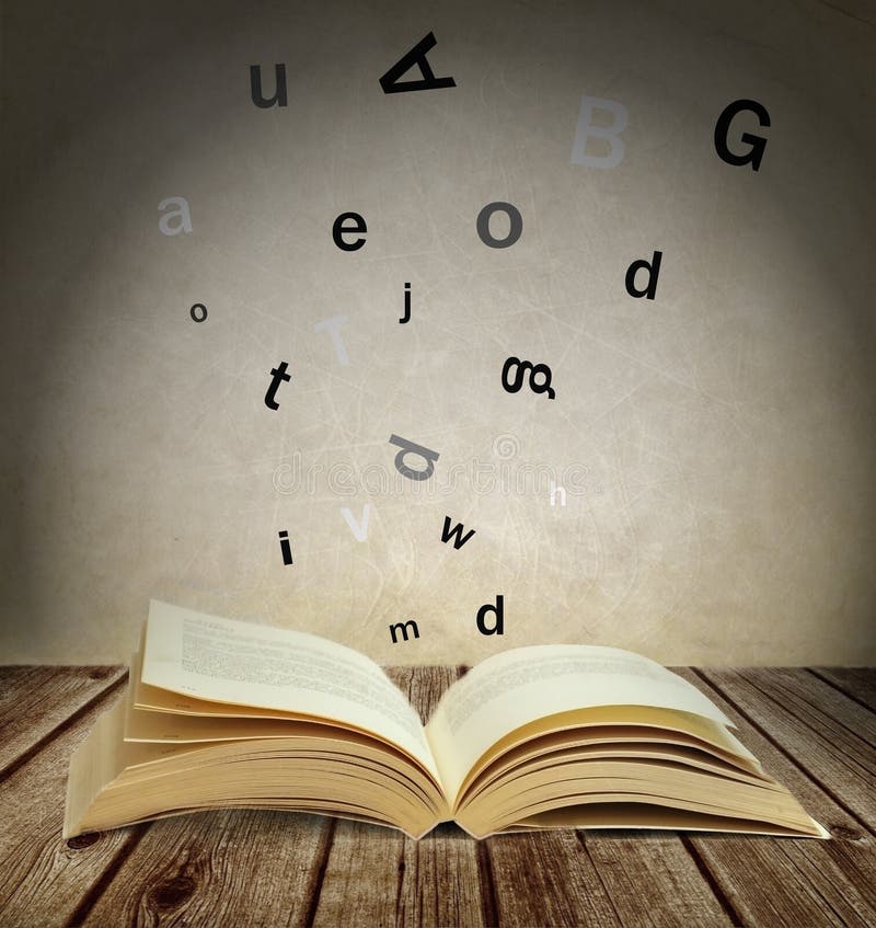 Libro Abierto Con Las Letras Del Vuelo Foto de archivo - Imagen de ...