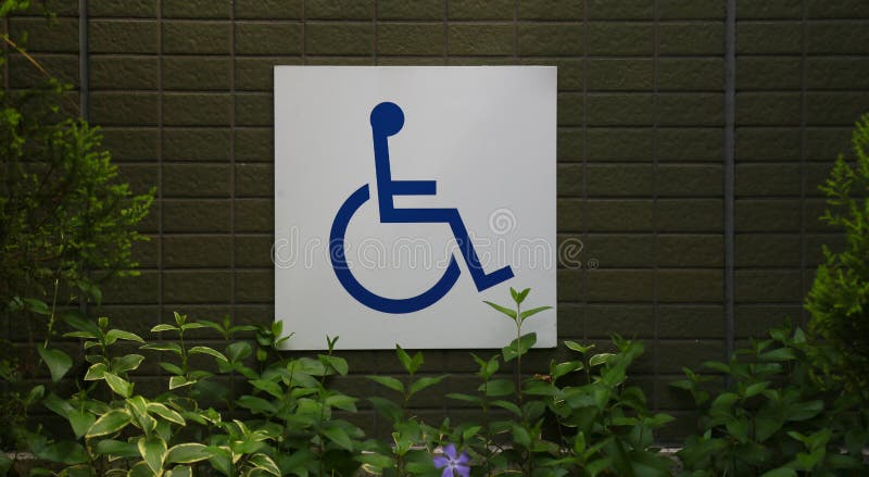 Letrero De La Silla De Ruedas Imagen de archivo - Imagen de pared ...
