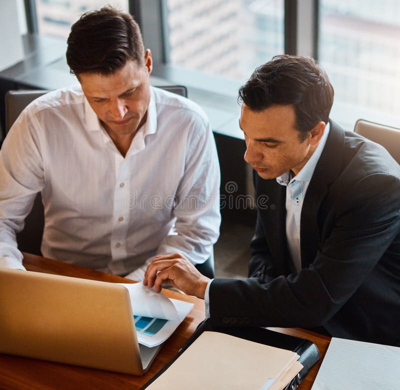 Lets Discuss these Figures. Two Businessmen Having a Discussion while ...