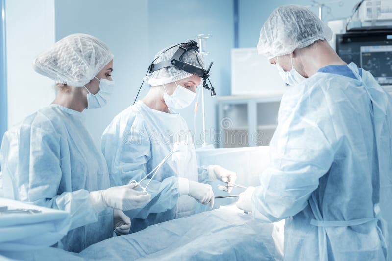 Reliable Qualified Medics Standing and Doing the Operation. Stock Image ...