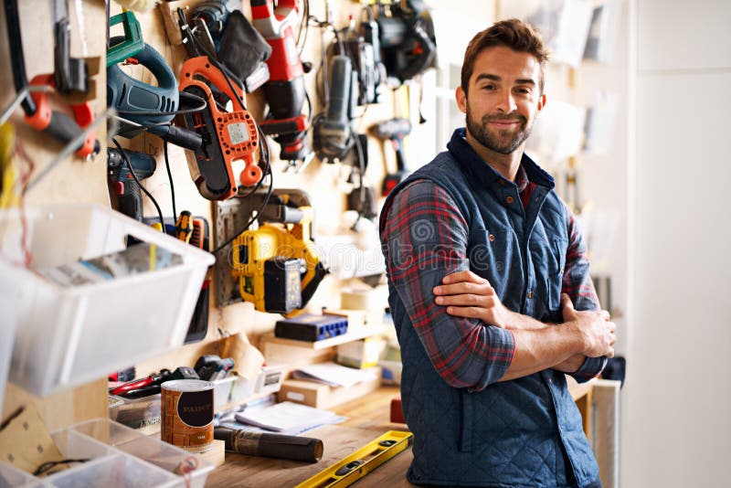 Lets Fix it. Portrait of a Handsome Young Handyman Standing in Front of ...