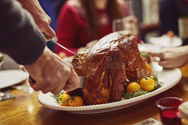 Lets Get this Feast Started. Closeup Shot of a Person Cutting into a ...
