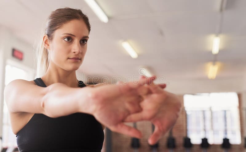 Lets Get Started. a Young Woman Doing Static Stretches before Working ...