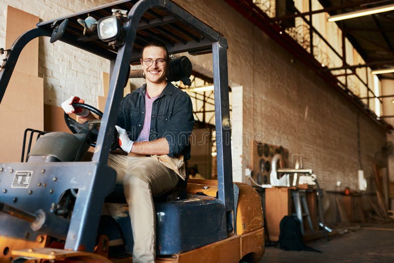 Lets Get Things Moving. a Young Male Warehouse Worker Driving a ...
