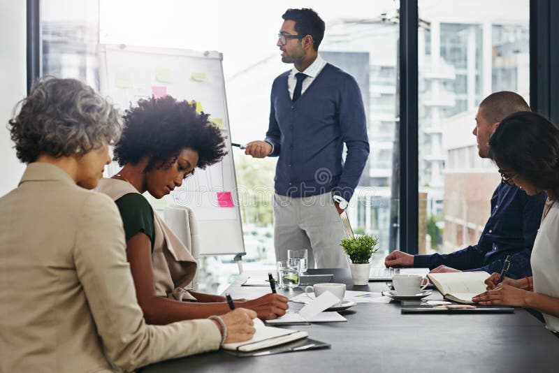 Lets Go Over the Numbers. Shot of Businesspeople in an Office. Stock ...