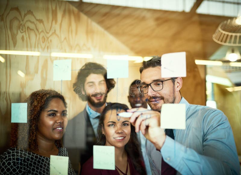 Lets Keep it Simple yet Effective. Coworkers Using Sticky Notes on a ... Lets Keep it Simple yet Effective. Coworkers Using Sticky Notes on a ...