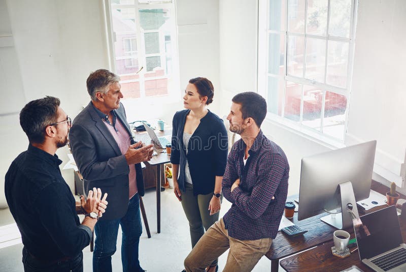 Lets See Where these Ideas Lead. a Group of Designers Having a ...