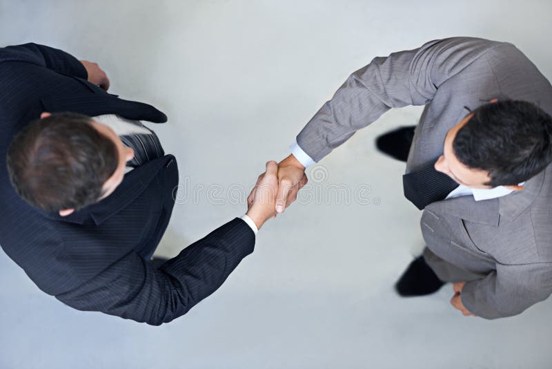 Lets Shake on it. High Angle View of Two Businessmen Shaking Hands ...