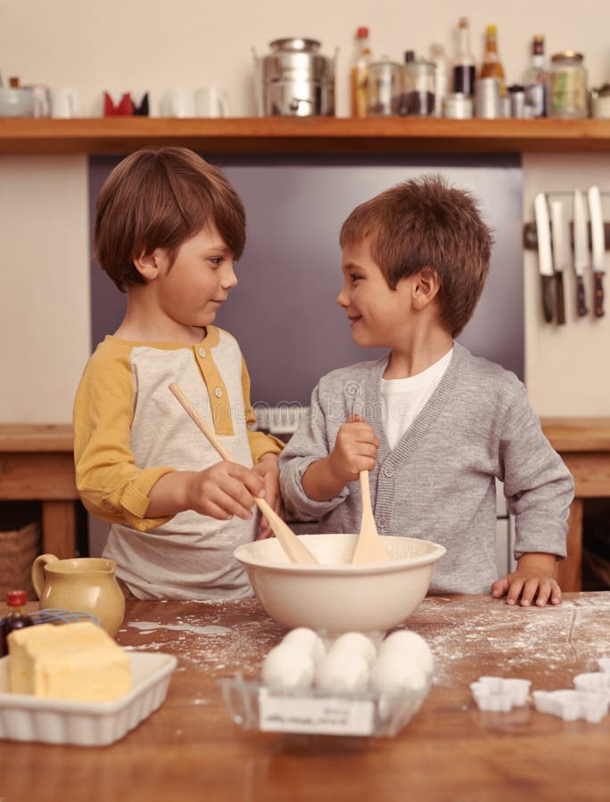 Lets Stir Together...two Young Brothers Baking in the Kitchen. Stock ...