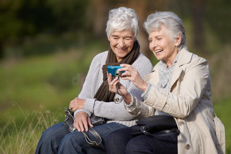 Lets Take One More...Two Senior Women Using a Digital Camera with a ...