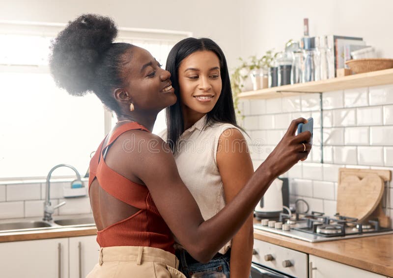 Lets Take a Selfie. Two Young Friends Taking a Selfie while Spending Time Together at Home ...