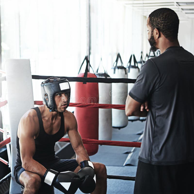 Lets Talk about Tactics. a Man Training in the Boxing Ring with a Coach ...