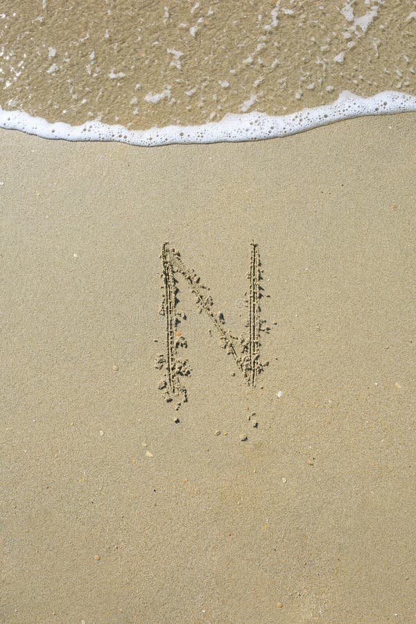 Letter Drawn on the Sand Beach Stock Image - Image of draw, font: 95363019
