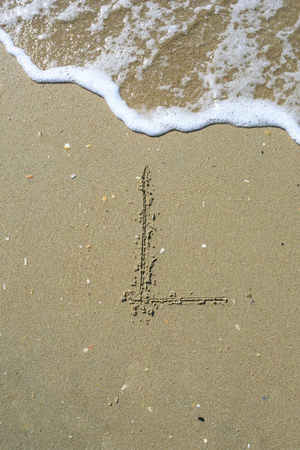 Letter Drawn on the Sand Beach Stock Photo - Image of education ...