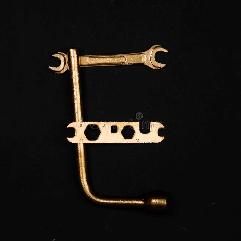 Letter E. Alphabet Made of Golden Repair Tools Stock Image - Image of ...