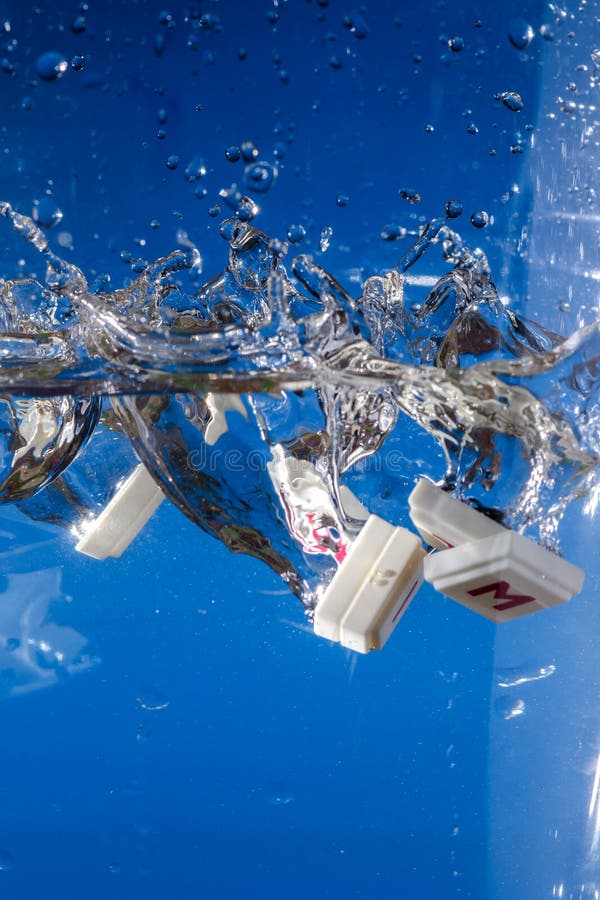 Letter Falling into the Water Stock Photo - Image of splash, still ...