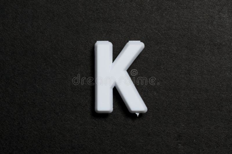 Pegboard Letter K on a Black Background Stock Image - Image of ...