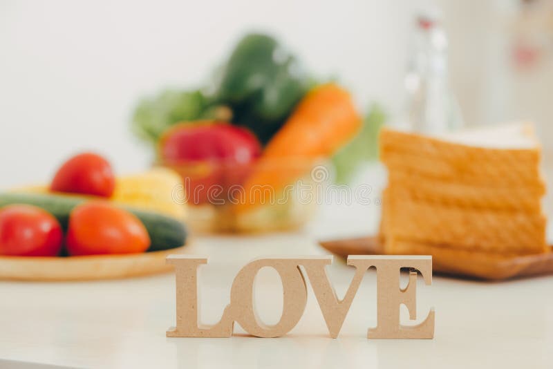 Letter LOVE on a Wooden Table in the Rustic Kitchen Stock Image - Image ...