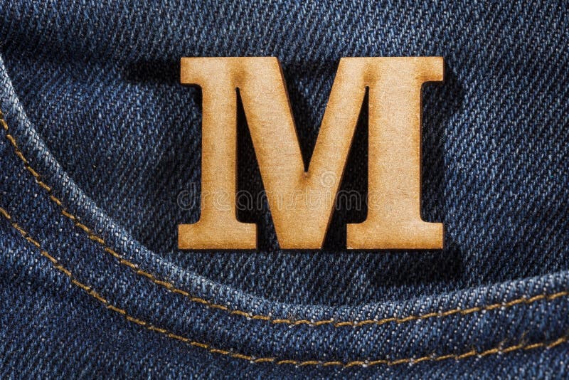 Letter M of the Alphabet - Blue Jeans Texture Background. Top View ...