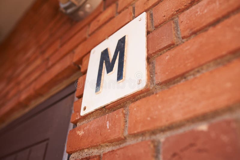 The Letter M on a Sign on a Building Stock Photo - Image of colorful ...