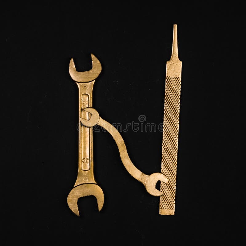 Letter N. Alphabet Made of Golden Repair Tools Stock Photo - Image of ...