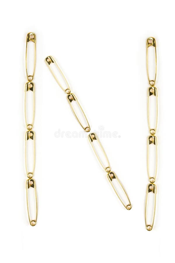 Letter Spelled Out in Gold Colored Safety Pins Stock Photo - Image of ...