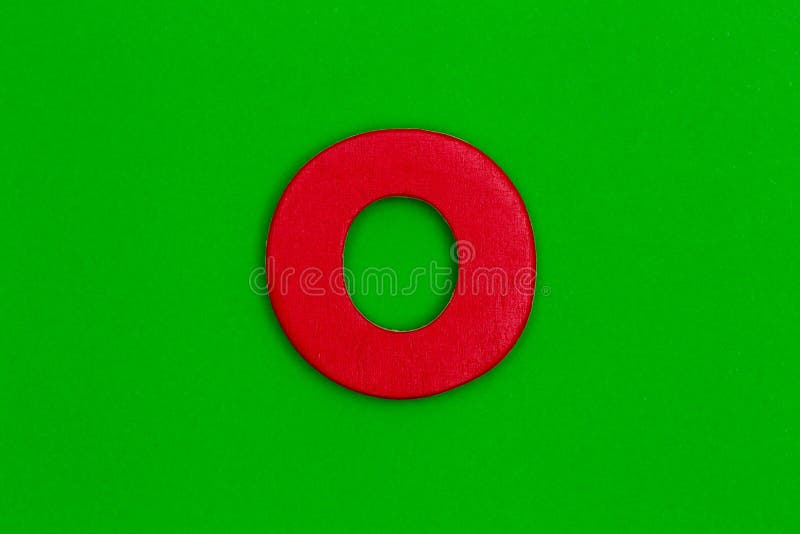 Letter O Made of Wood Painted Red on Green Background Stock Photo ...