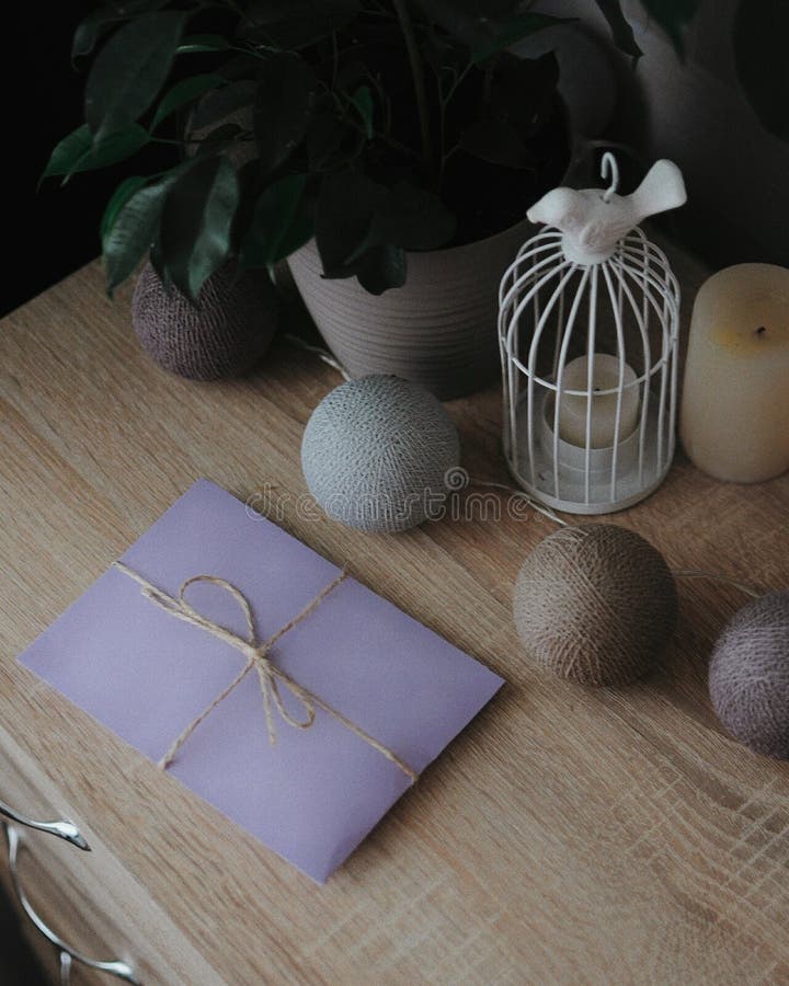 Letter in Purple Envelope on the Table with Decorative Light Bulbs ...