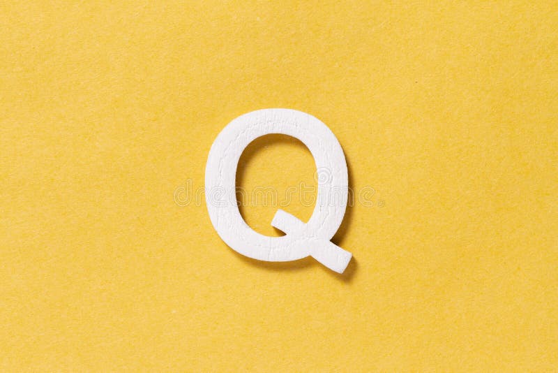 Letter Q of the Alphabet Isolated on Yellow Background, Top View Stock ...