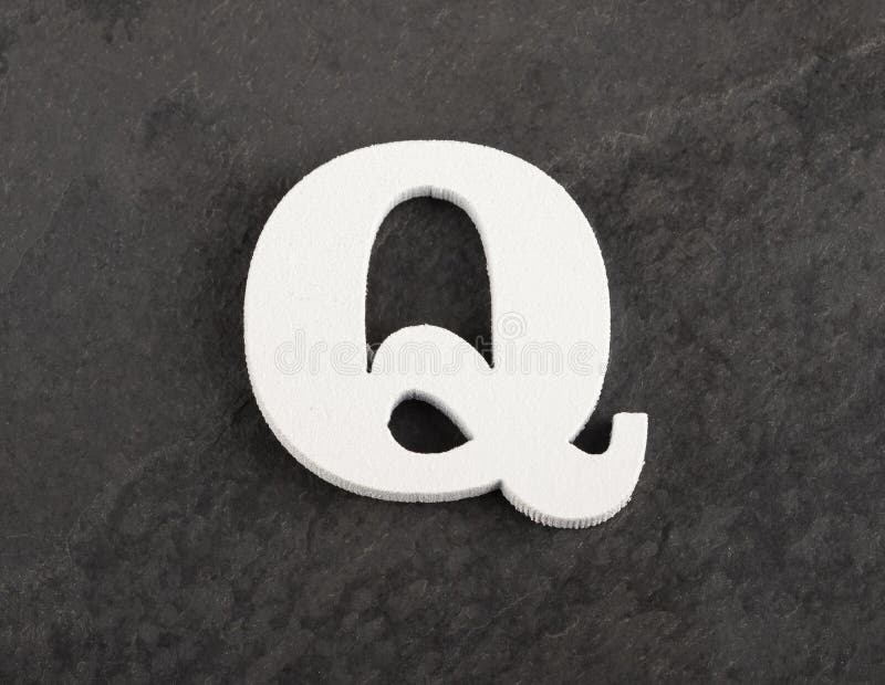 Letter Q from Blank Alphabet on Gray Background - Top View Stock ...